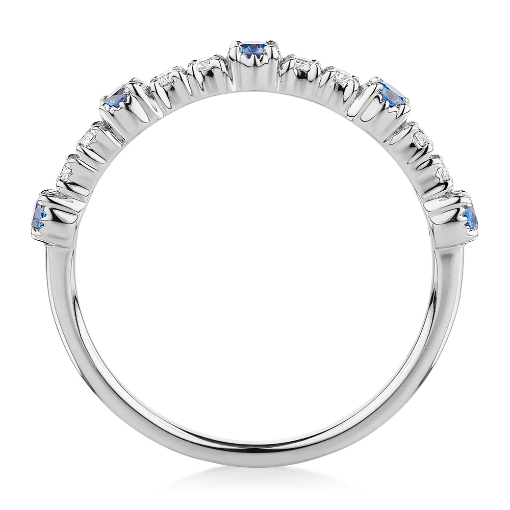 Wedding or eternity band with blue topaz and diamond simulants in 10 c ...